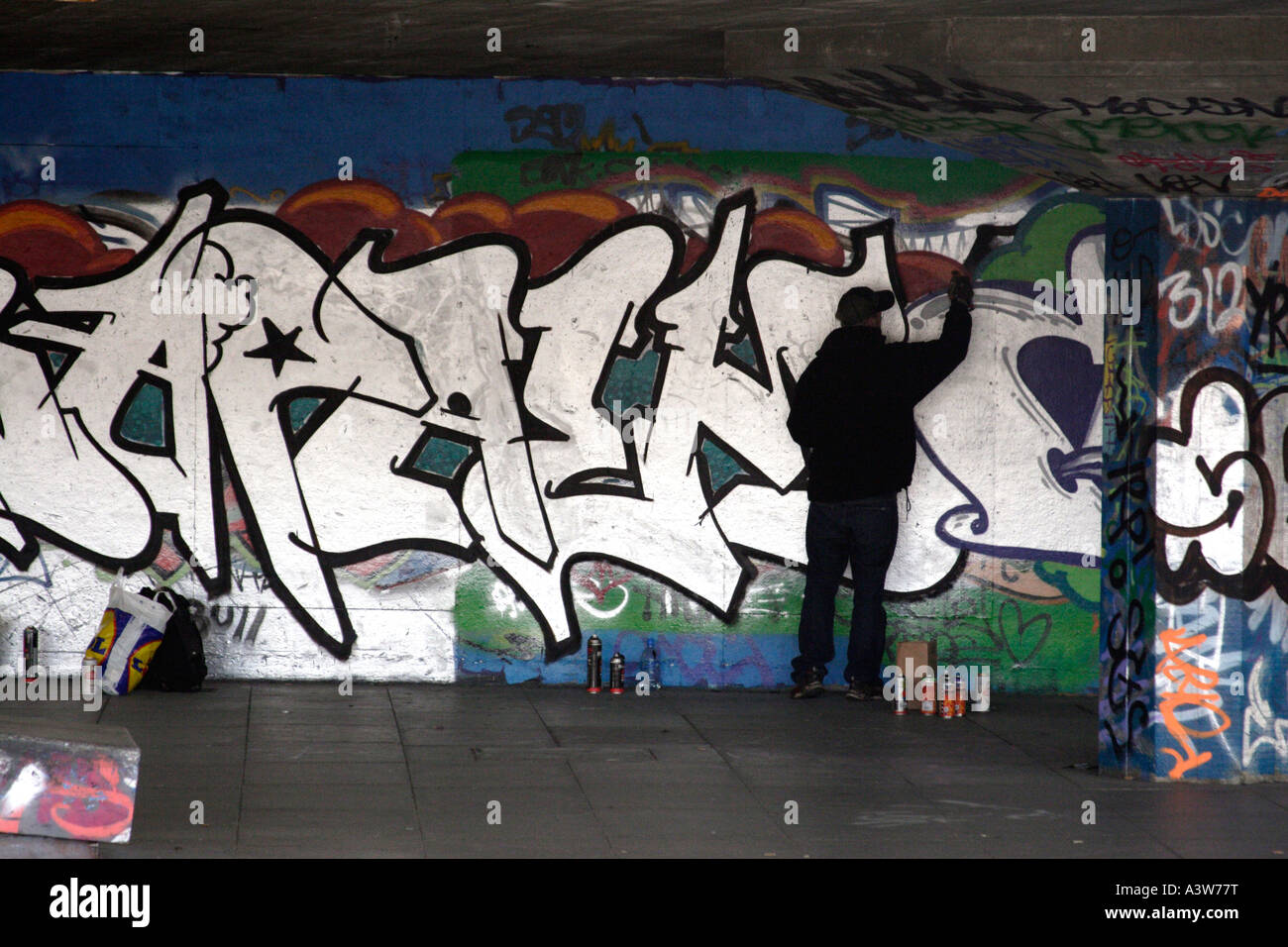 Graffiti artist under National Theatre South Bank London Stock Photo ...