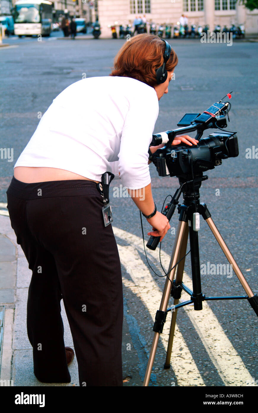 BBC TV camerawoman with a lightweight Sony camera in London Stock Photo ...