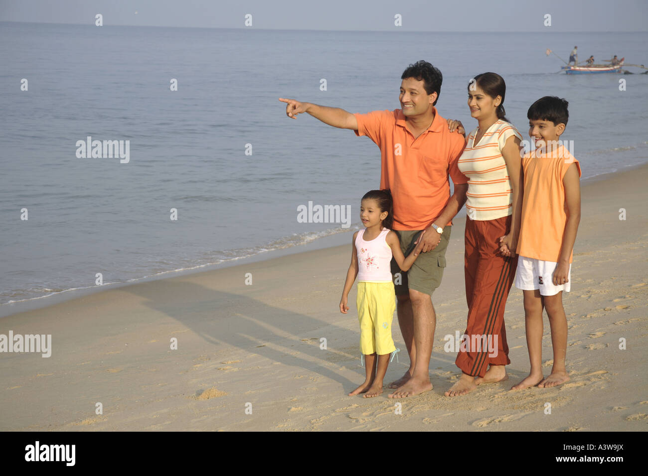 Happy indian family four walking hi-res stock photography and images ...