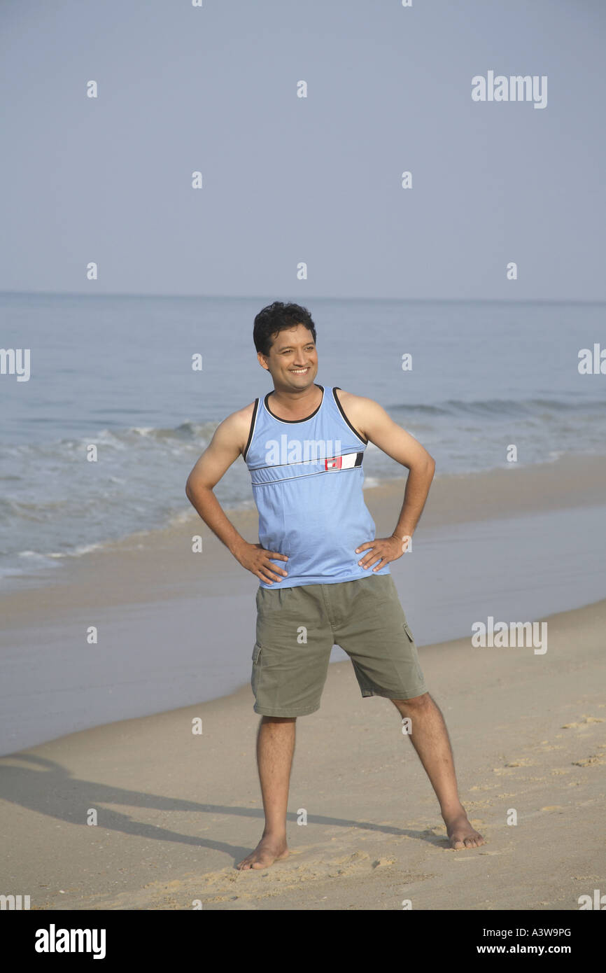 Indian man exercising on the beach - MR#703D Stock Photo - Alamy