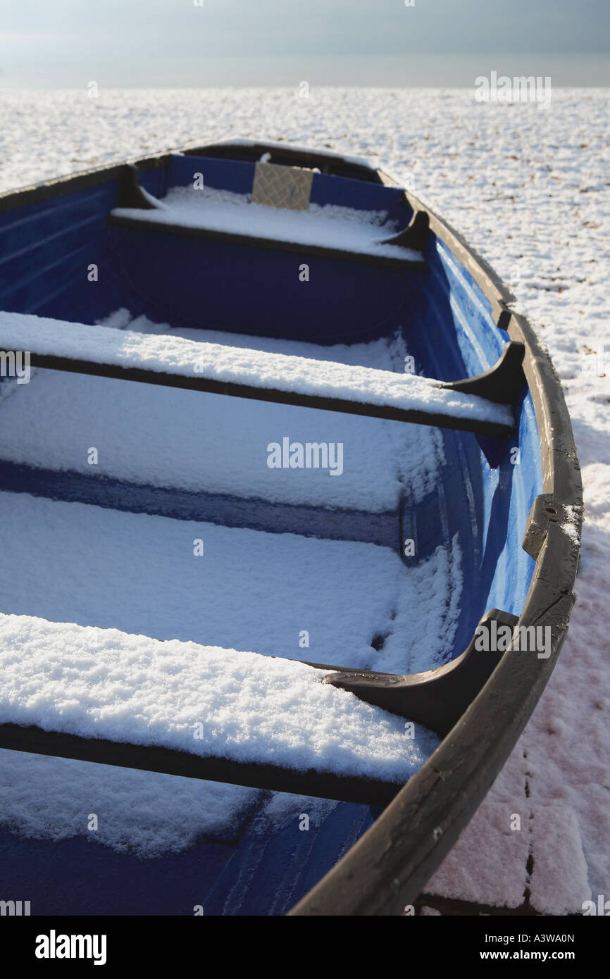 Snow lying on a small fishing boat Stock Photo - Alamy