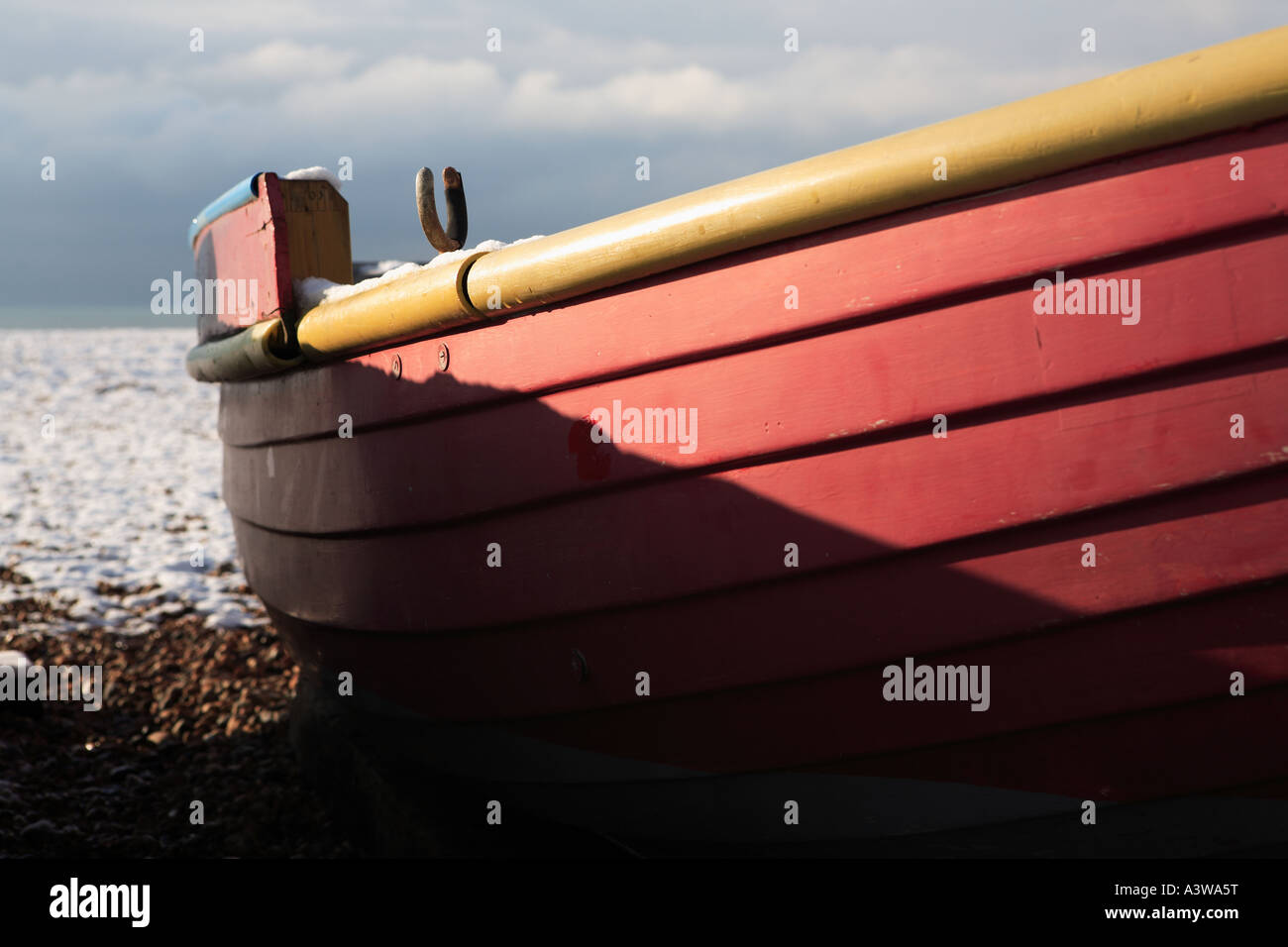 Snow lying on a small fishing boat Stock Photo - Alamy