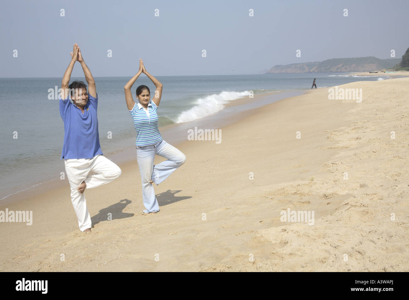 Indian couple exercising on the beach - MR# Stock Photo - Alamy