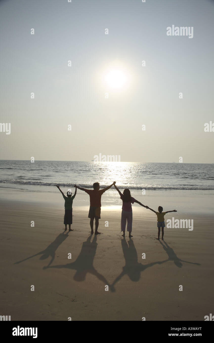 Happy family on beach sun shining hi-res stock photography and images ...