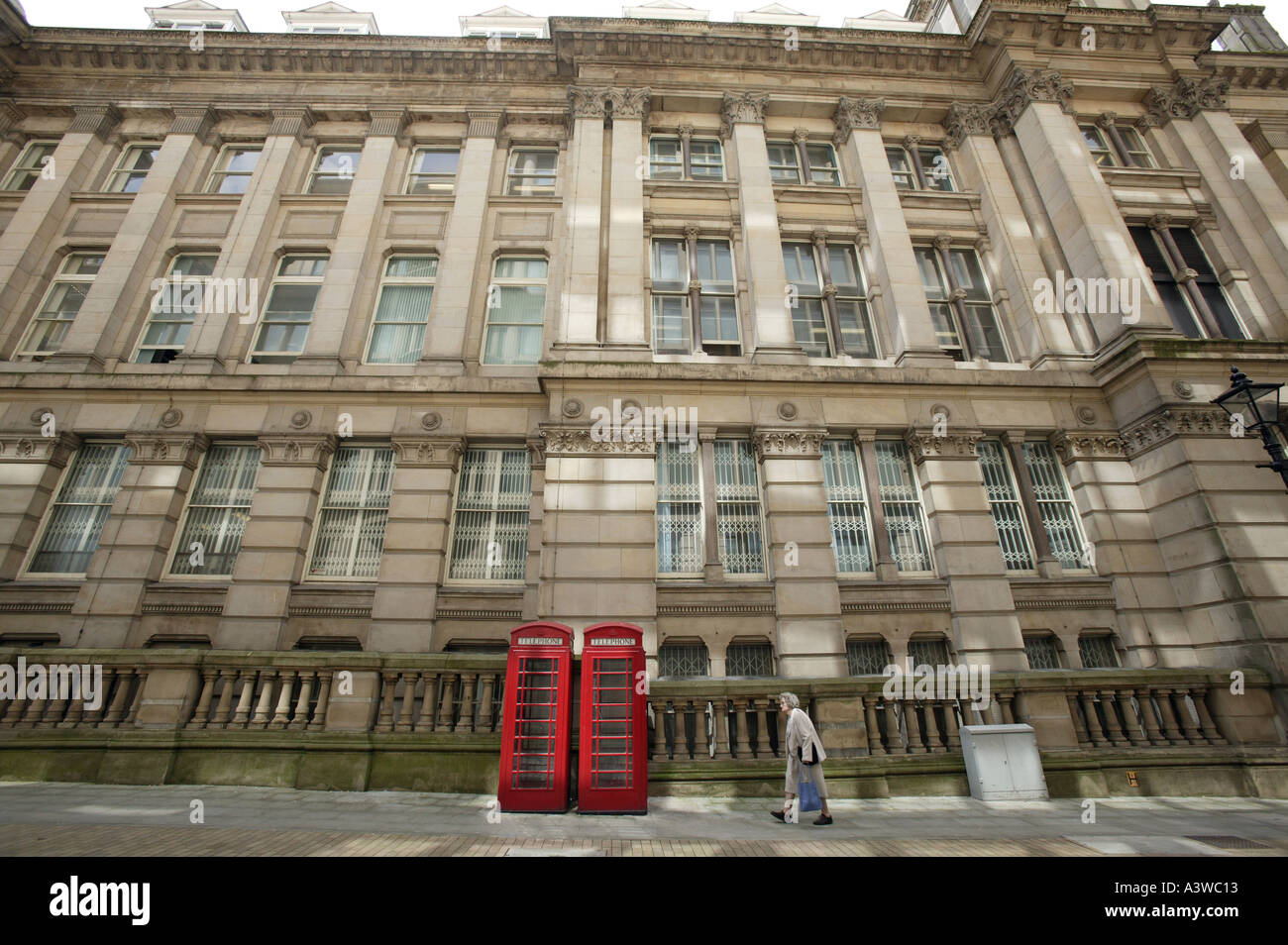 Two red telephone boxes along side the Victorian Council House in ...