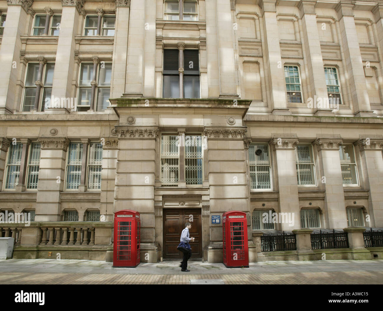 Two red telephone boxes along side the Victorian Council House in ...