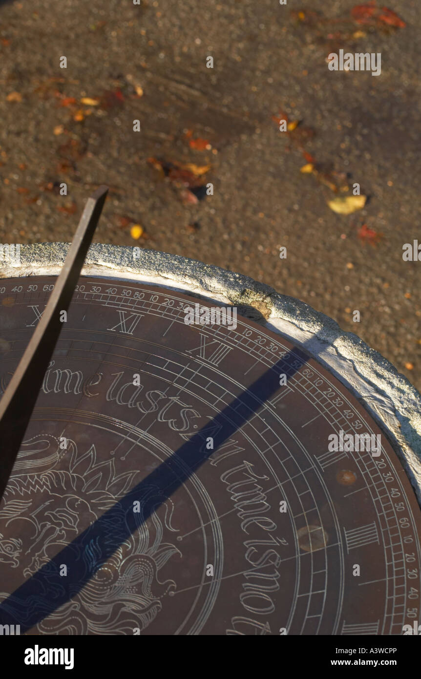 The shadow cast by the gnomon of a sundial at Wakehurst Place, showing ...