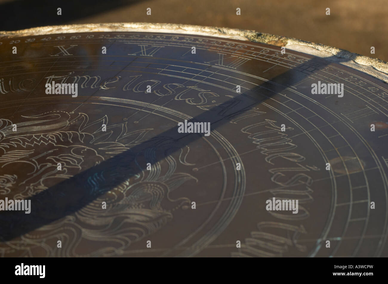 The shadow cast by the gnomon of a sundial at Wakehurst Place, showing ...
