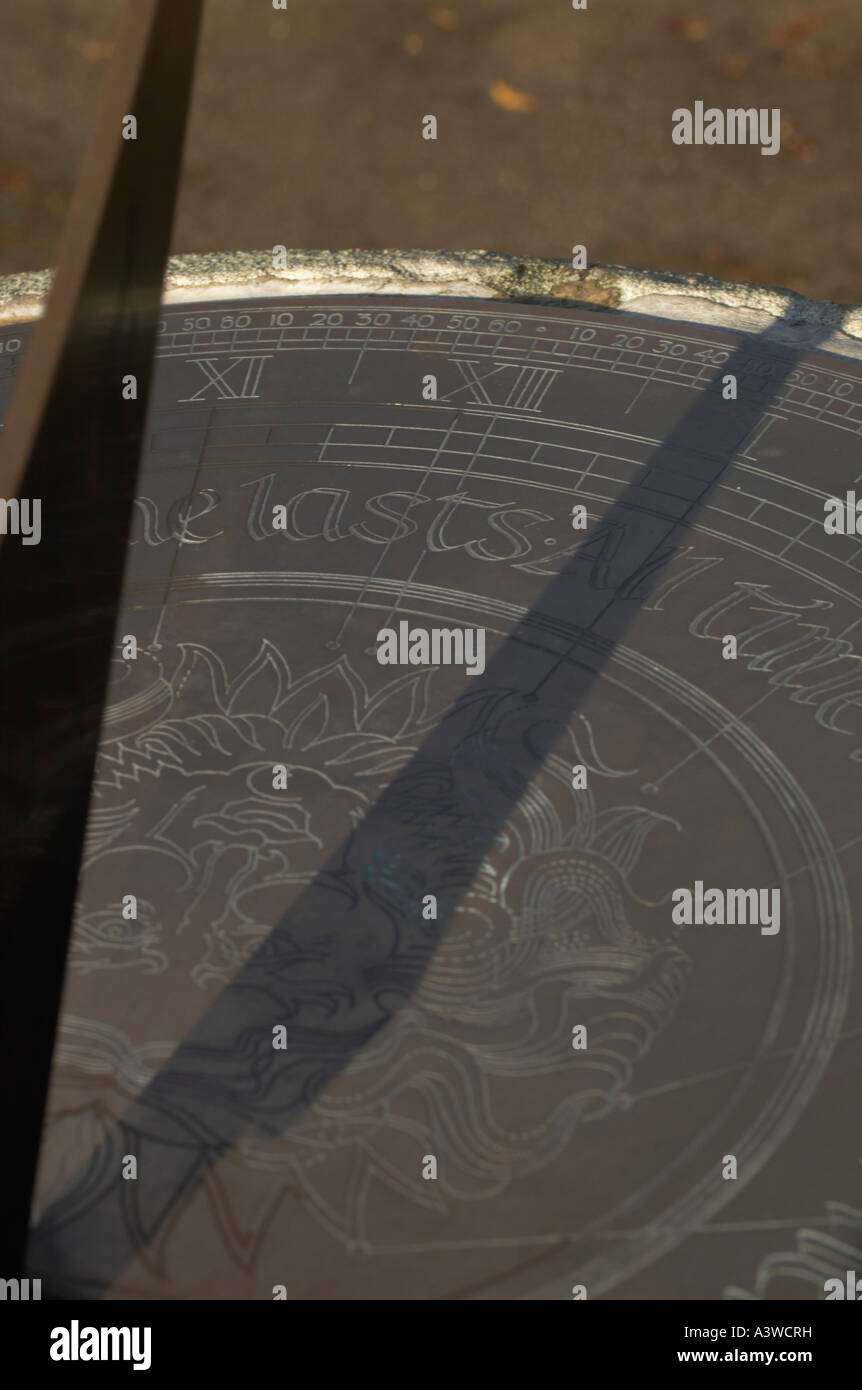 The shadow cast by the gnomon of a sundial at Wakehurst Place, showing ...