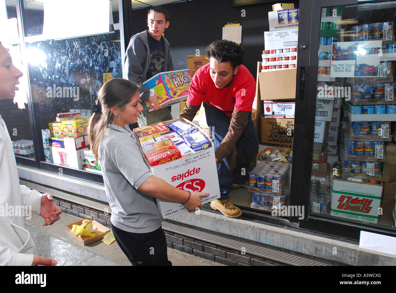 High School Children collecting food for charity. Helping the needy ...