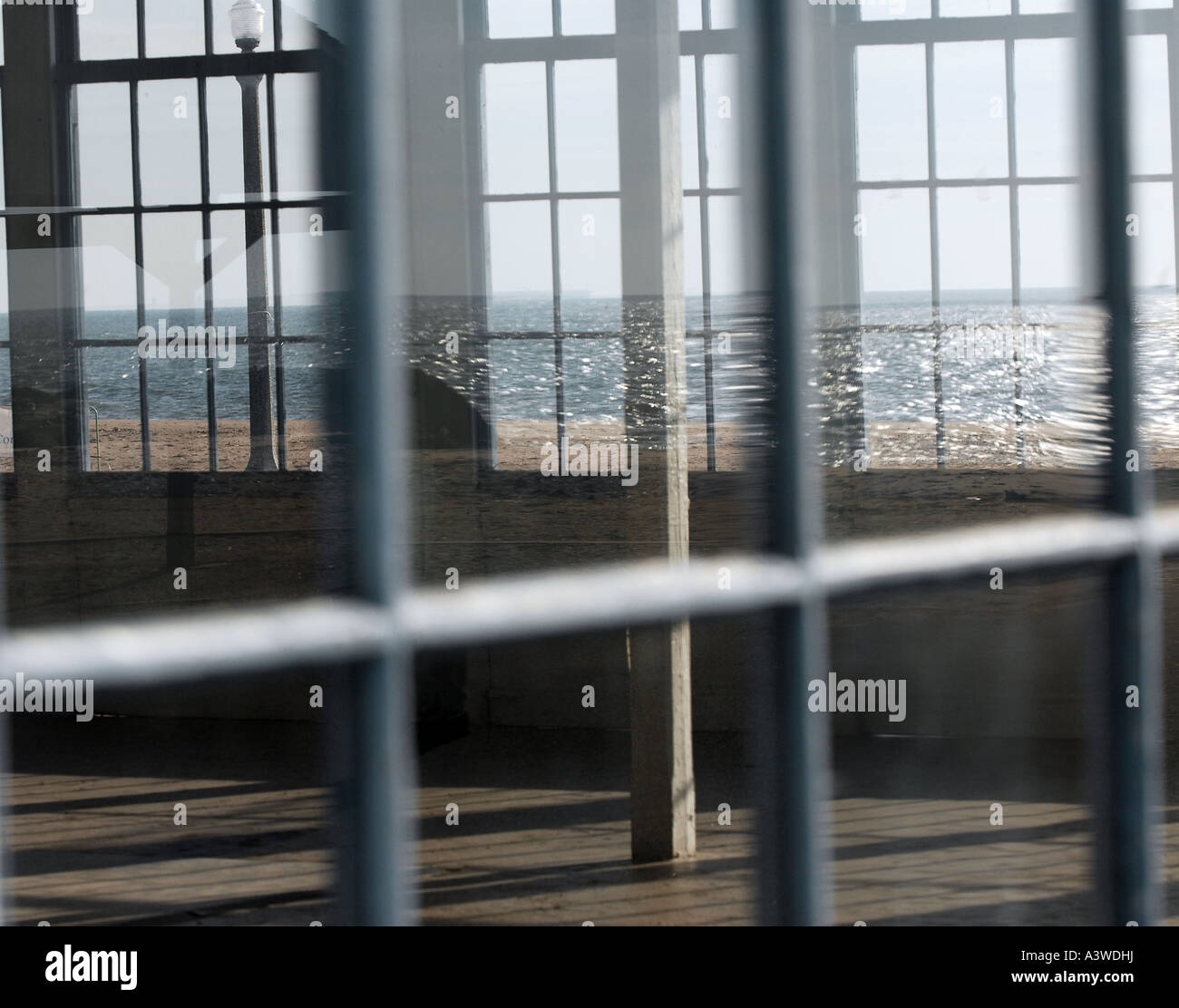 Windows with sea reflected create a moody ethereal view Stock Photo - Alamy
