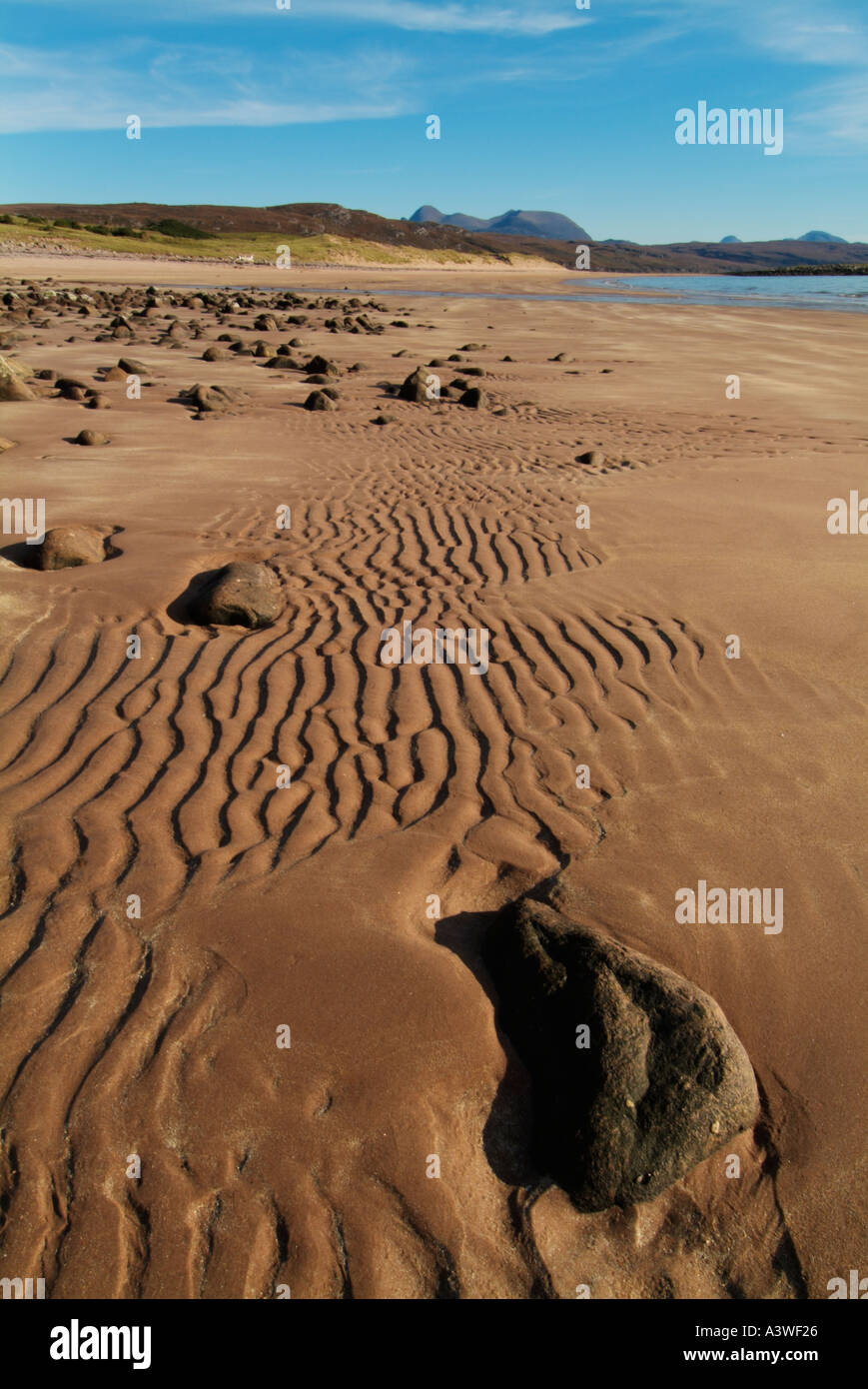 Sand ripples at Red Point beach looking towards the Torridon peaks ...