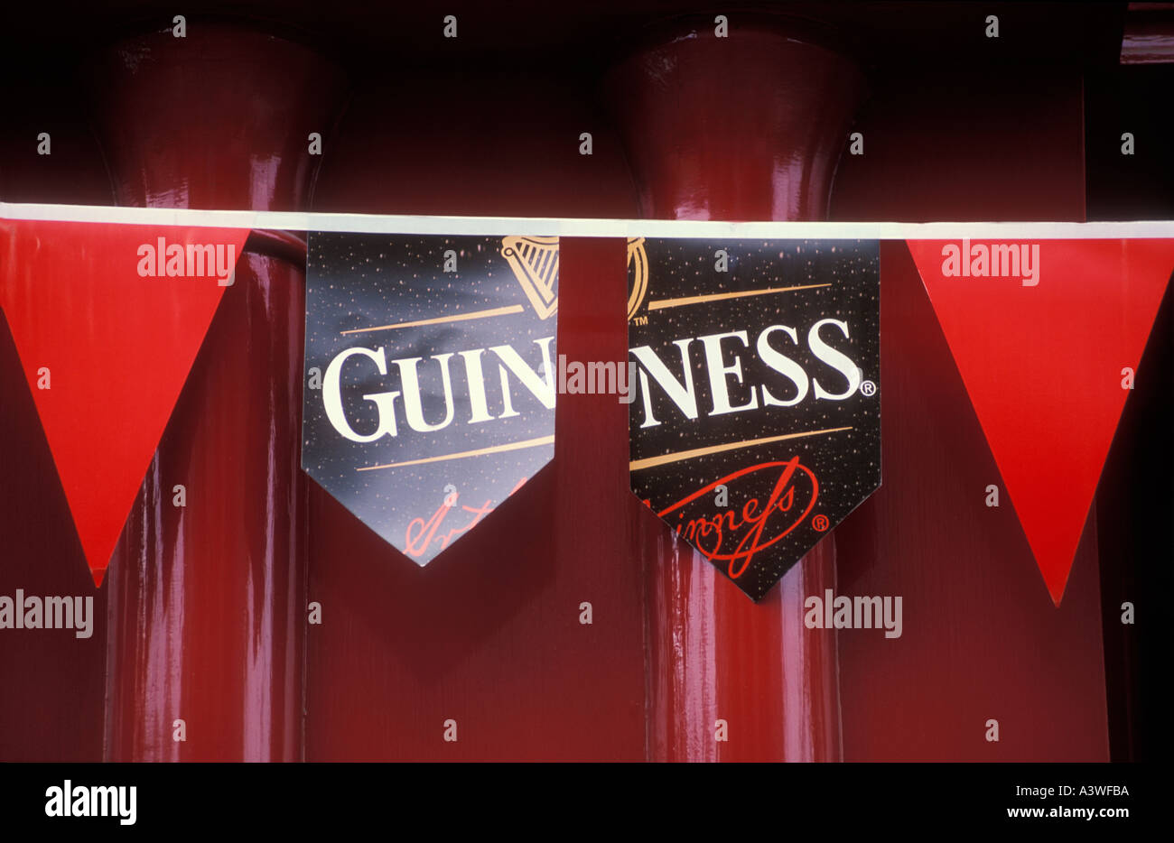 Flag pennants advertising Guinness outside public house in temple bar ...