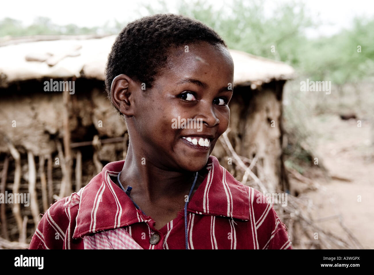A smiling girl in a village in Kenya, Africa Stock Photo - Alamy