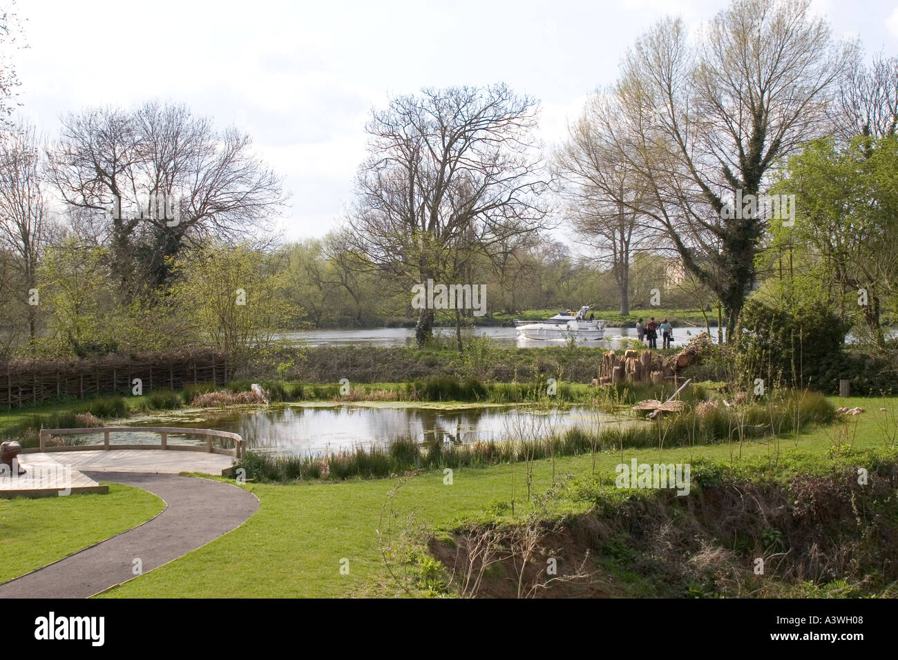 Pond with River Thames and cruiser behind Richmond GB UK Stock Photo ...