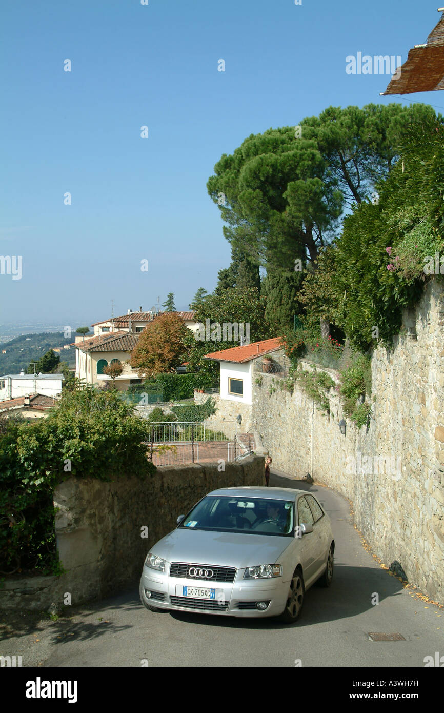 Audi car being driven through an Italian village Tuscany Italy Stock ...