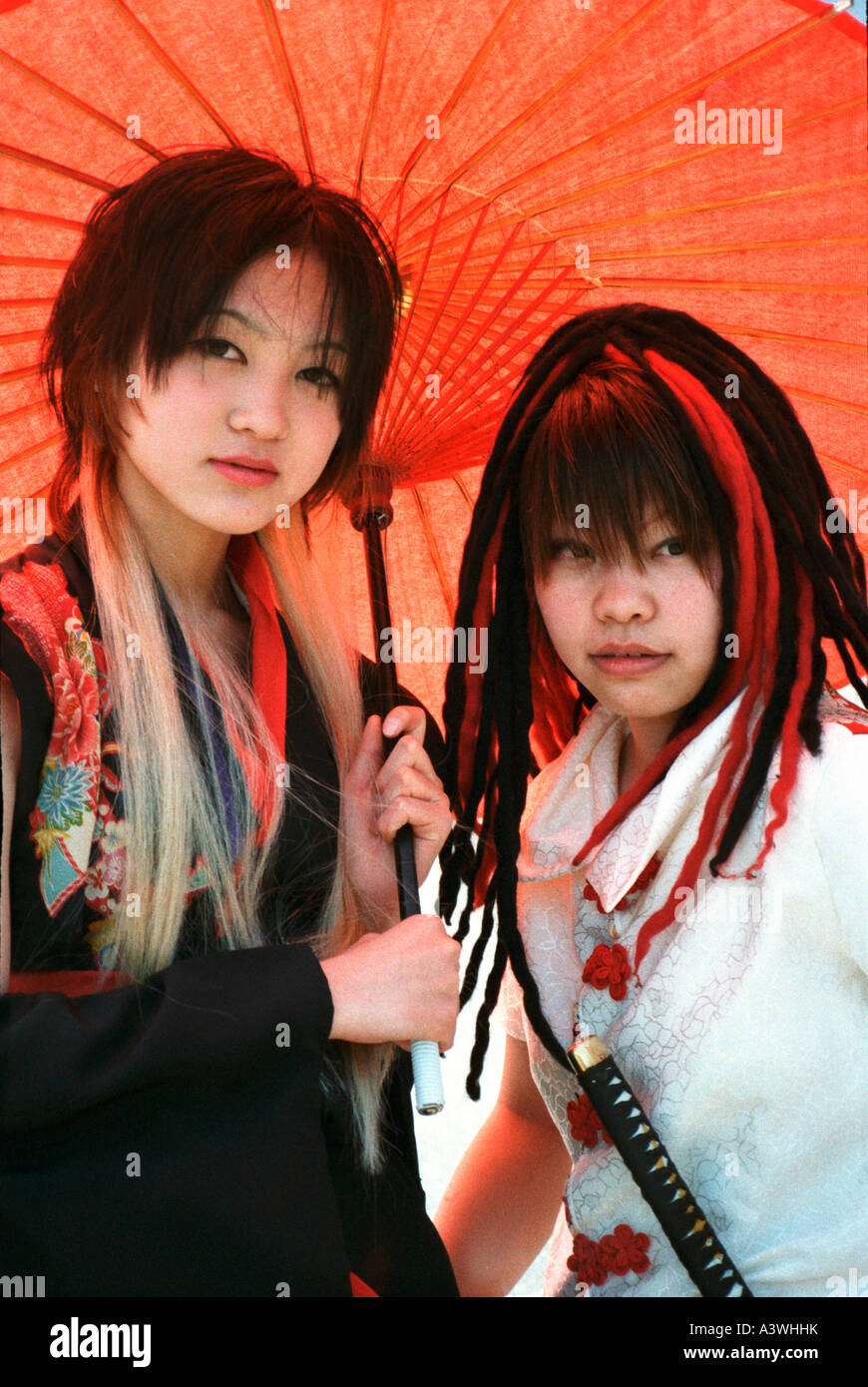 Cos-play teenagers under traditional red wagasa umbrella, Jingubashi ...