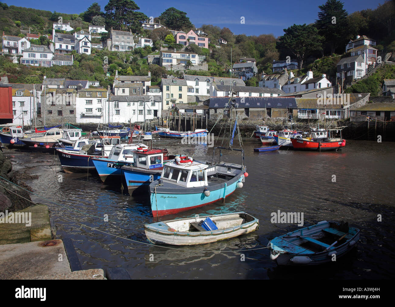 Fishing boats in Polperro harbour, Cornwall UK Stock Photo - Alamy