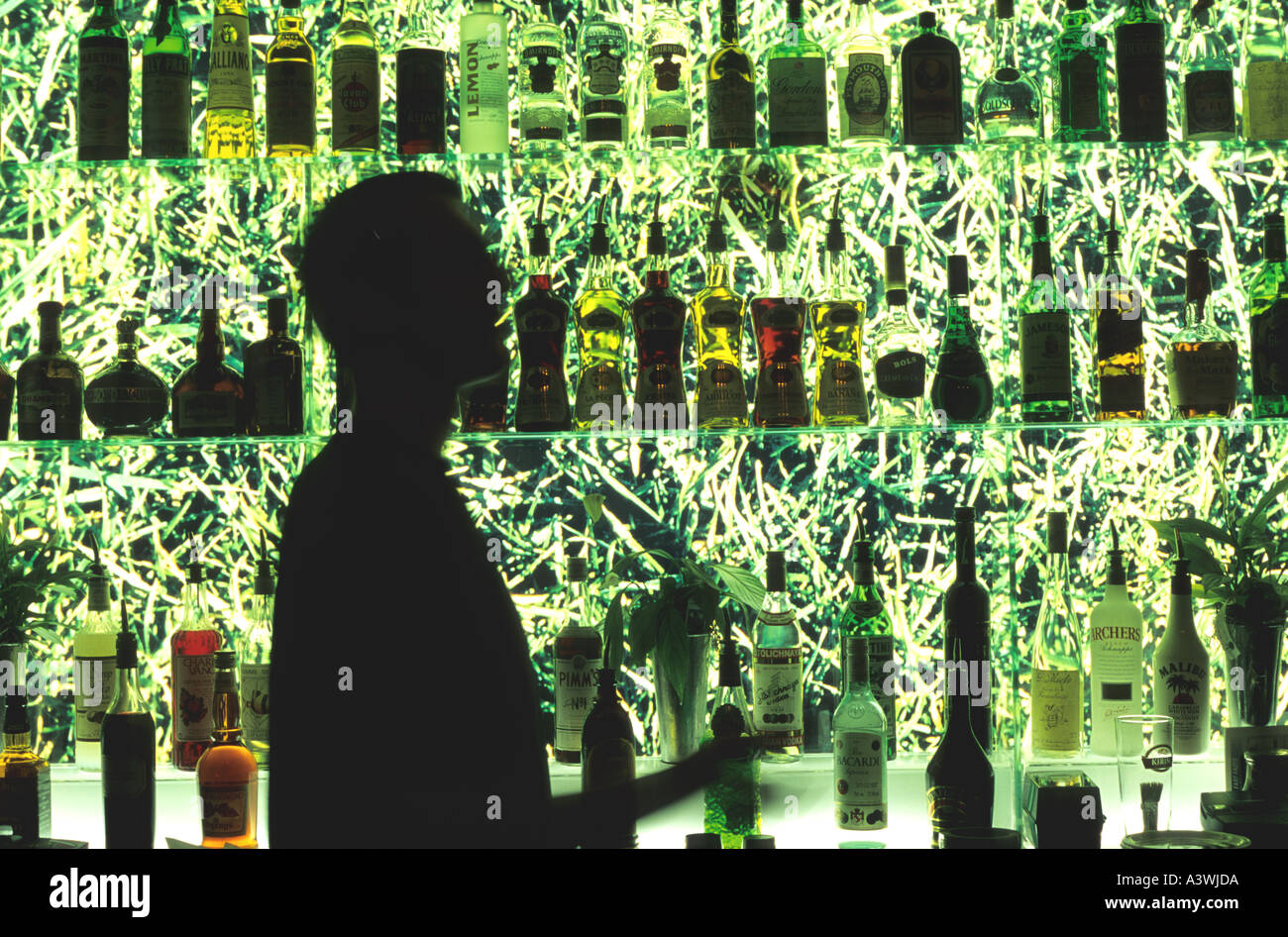 Barman with green bar london UK Stock Photo - Alamy