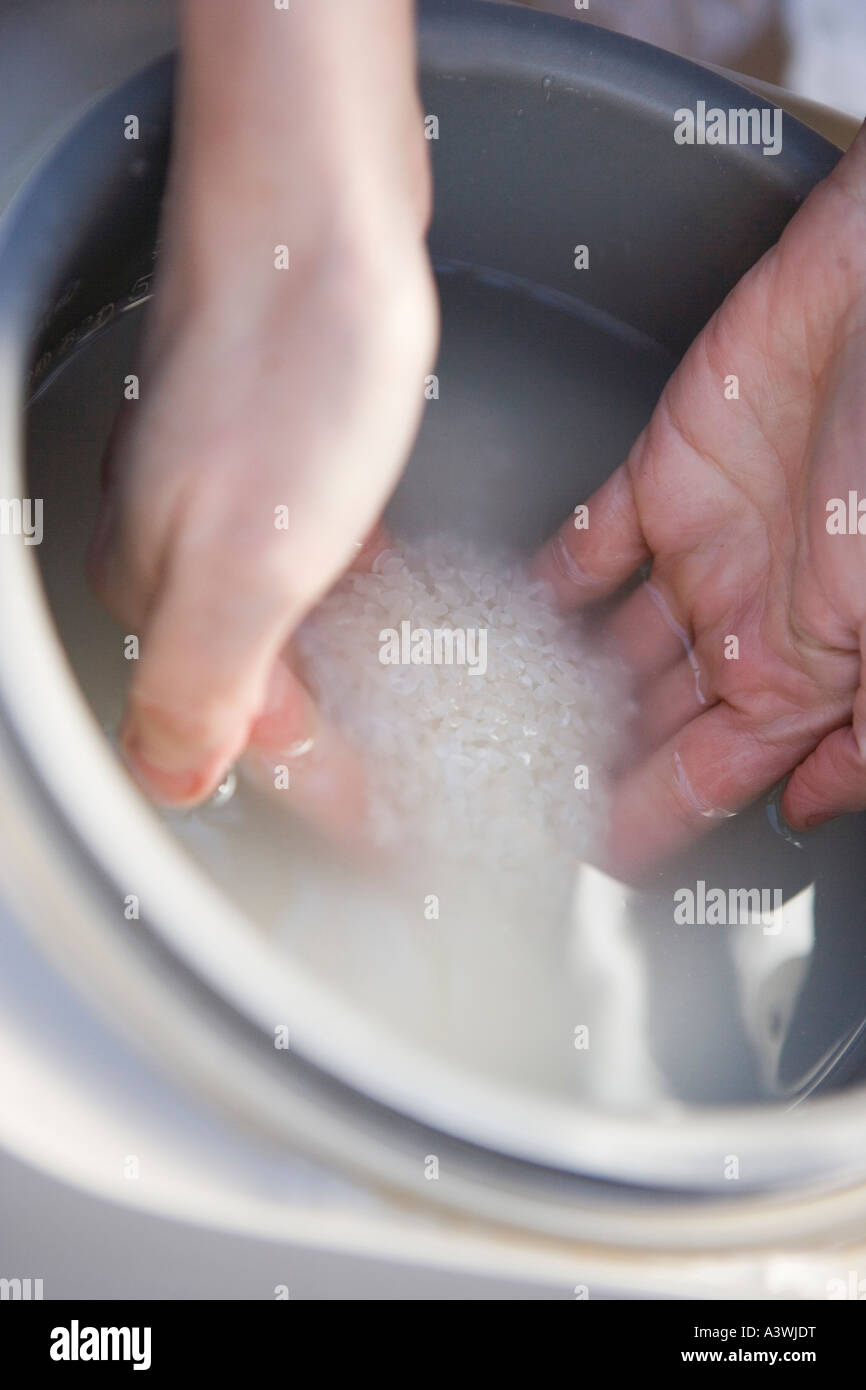 hands washing rice Stock Photo - Alamy