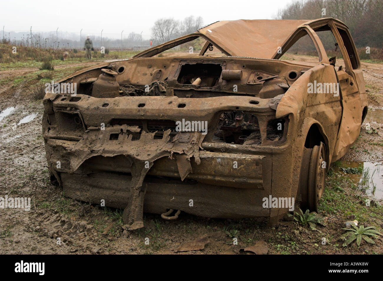 "Burnt out" rusting car abandoned on waste ground, England, UK, "close ...