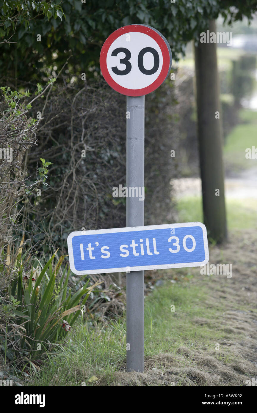 Speed restriction signs with added warnings in a Warwickshire village ...
