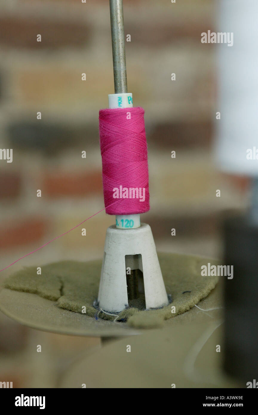 Pink cotton Reel in a tailors Stock Photo - Alamy