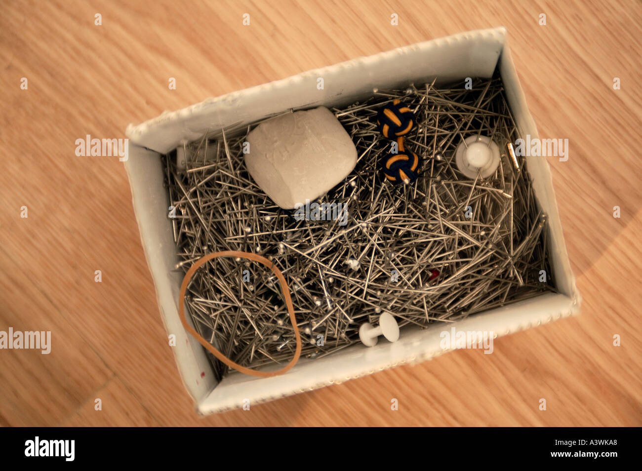 A box of pins on the floor Stock Photo - Alamy