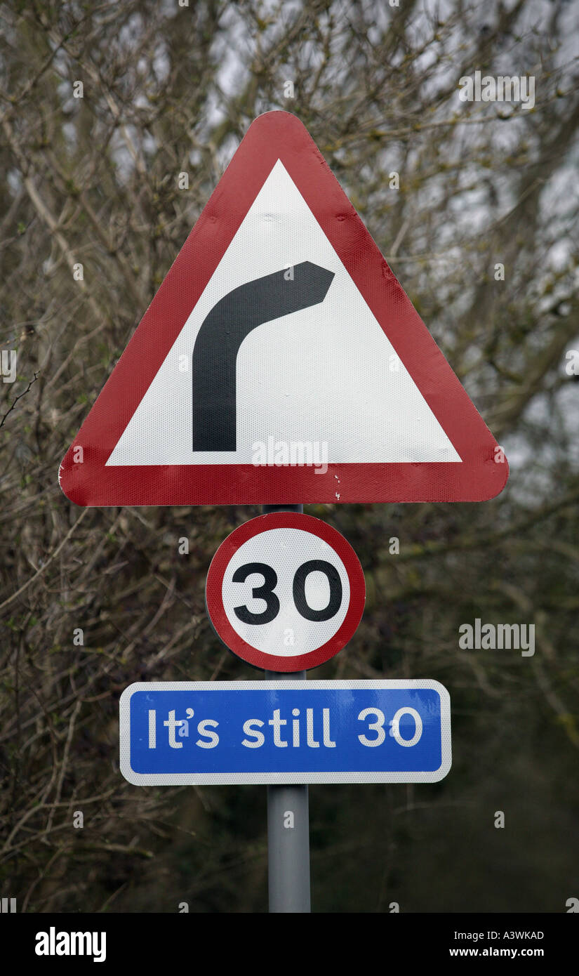 Speed restriction signs with added warnings in a Warwickshire village ...