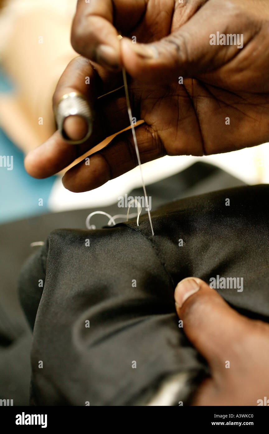 Stitching with a needle eye of sew Stock Photo - Alamy