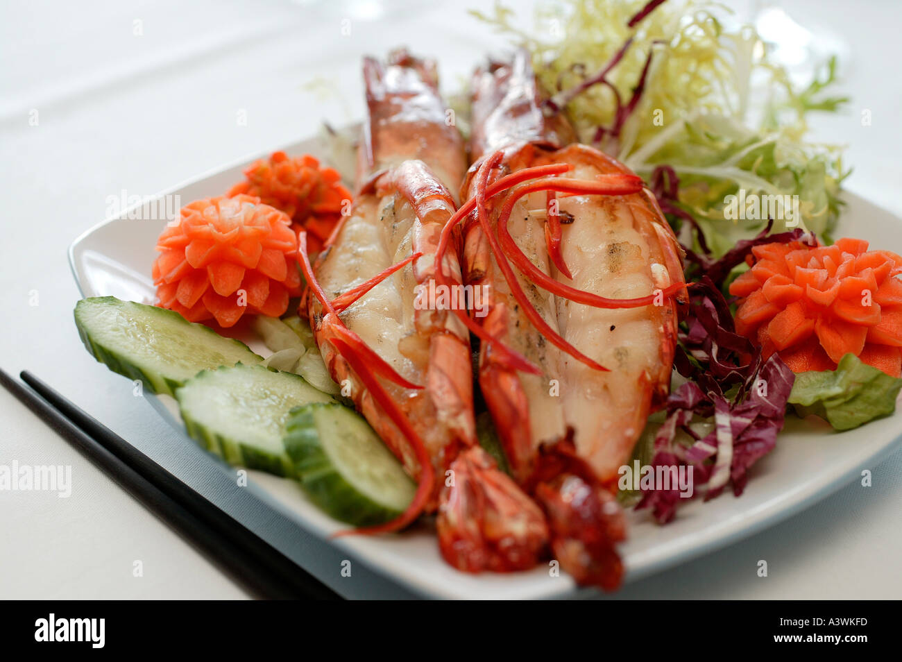 A large prawn on a square plate Stock Photo - Alamy