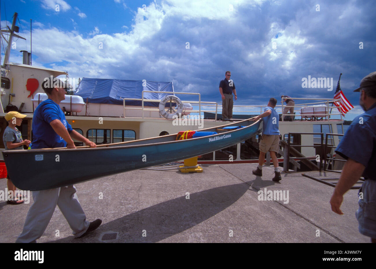 Loading canoe on ferry at Isle Royale National Park, Michigan Stock ...