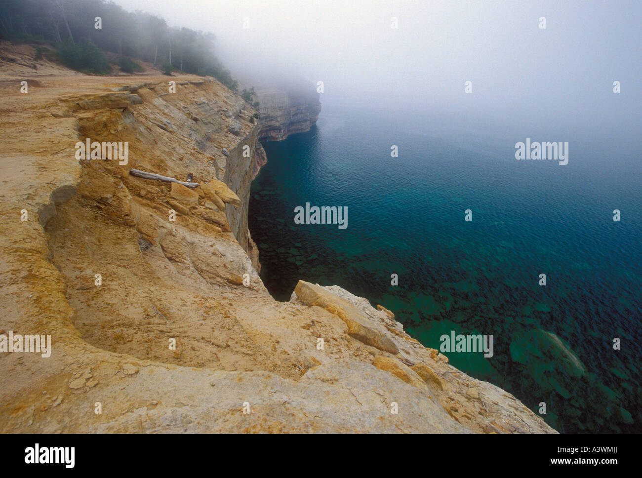The cliffs of Pictured Rocks National Lakeshore in the fog near ...