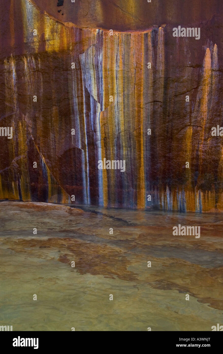 Detail shot of the colorful mineral stains on sandstone cliffs that ...