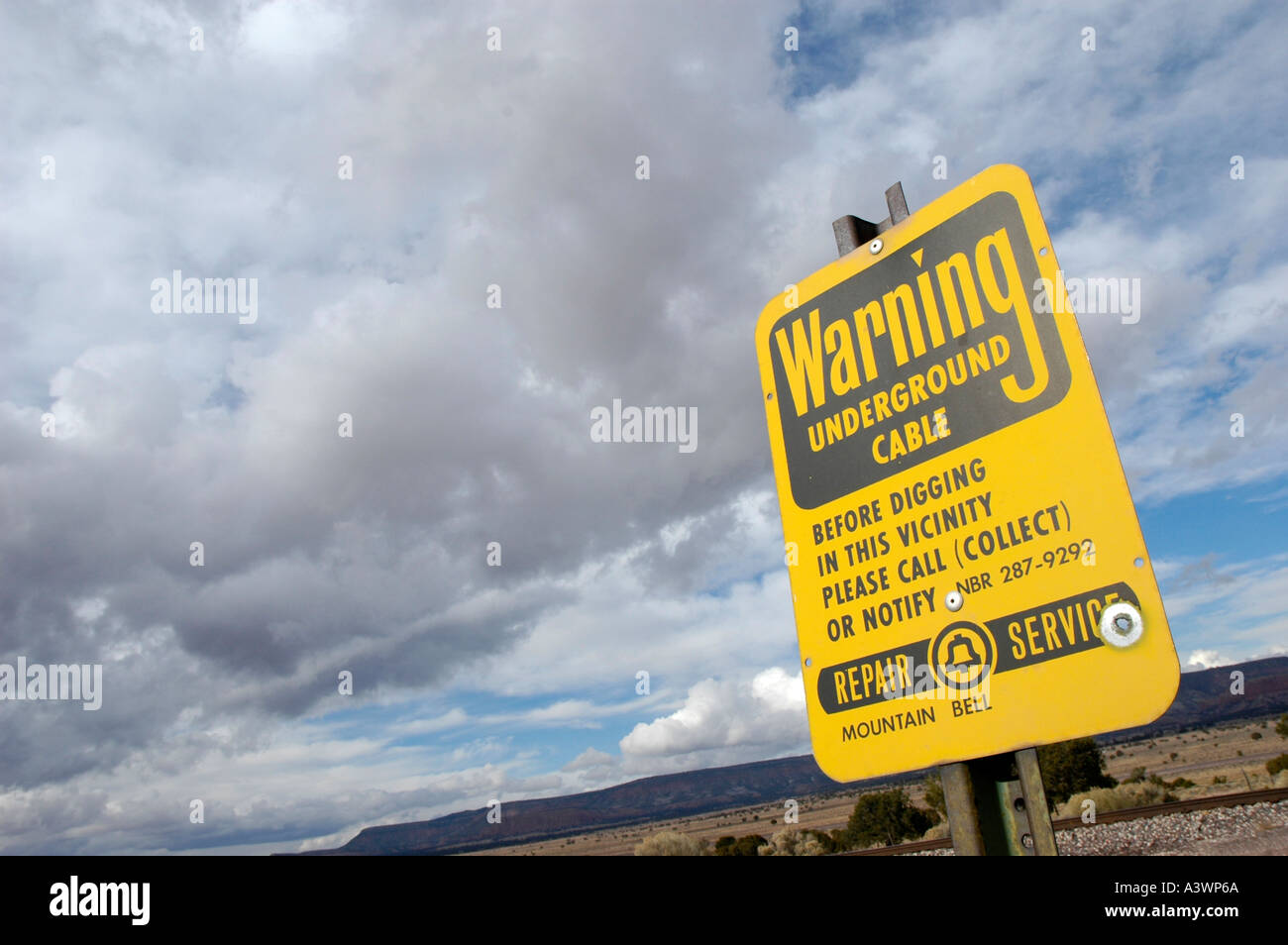 Dangerous road Crossing and underground cable signs at railroad ...