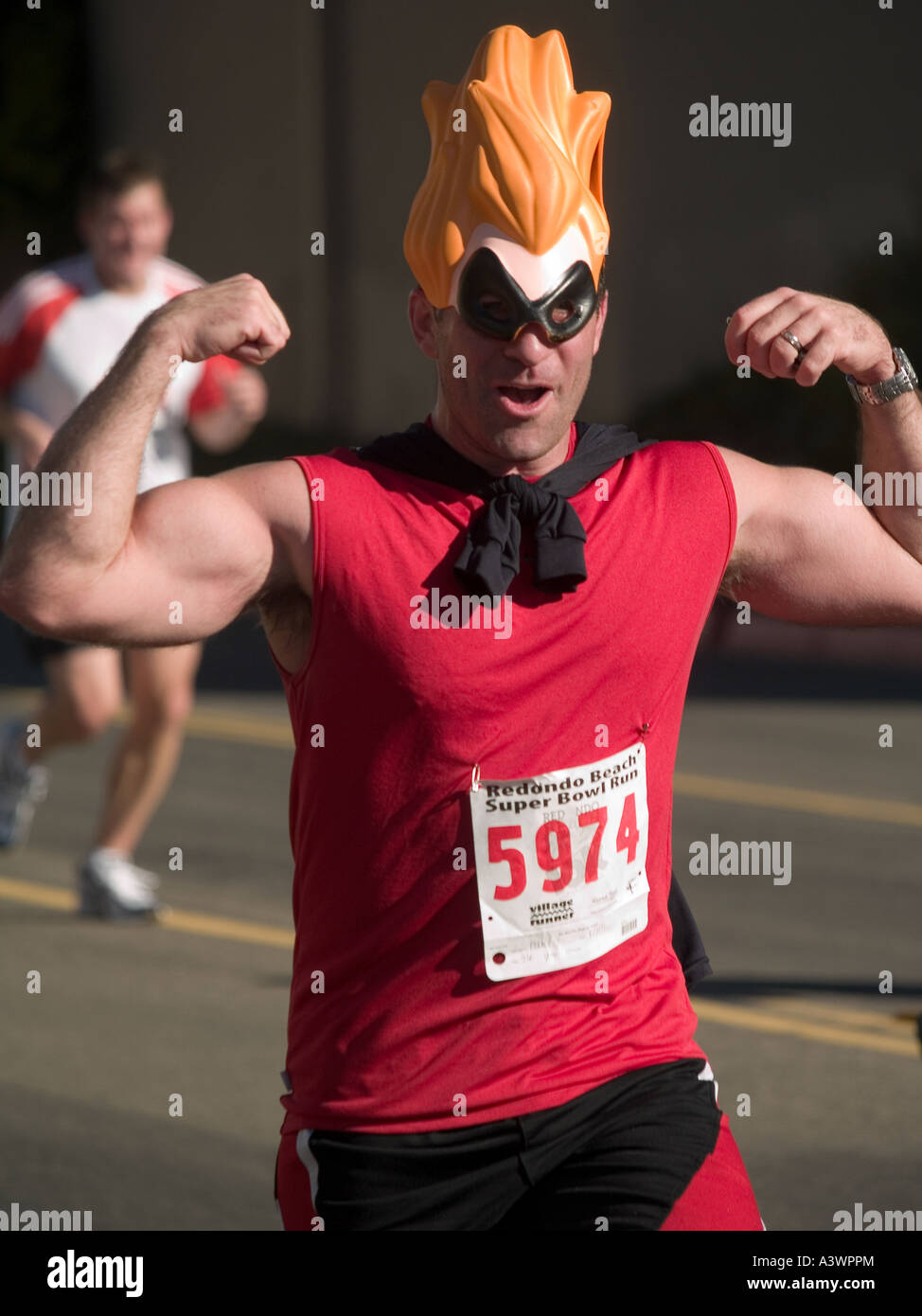 Male super hero type flexes muscles while approaching finish of Redondo ...