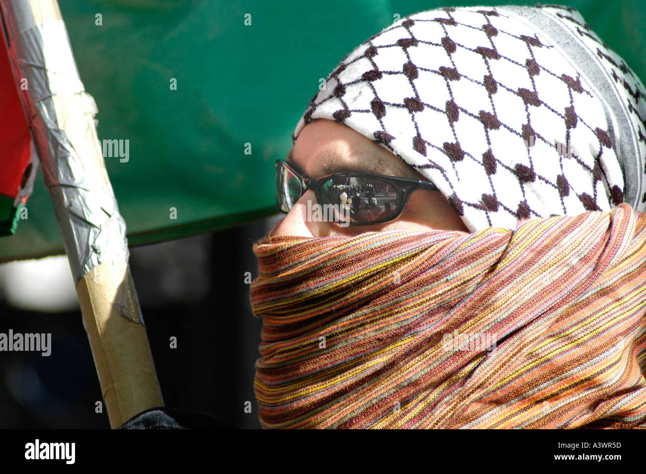 Young man at pro Palestinian and Pro Arab and anti Israel demonstration ...