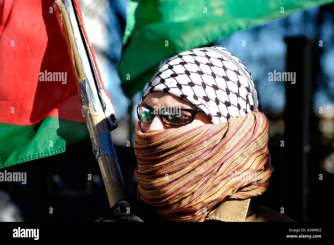 Young man at pro Palestinian and Pro Arab and anti Israel demonstration ...