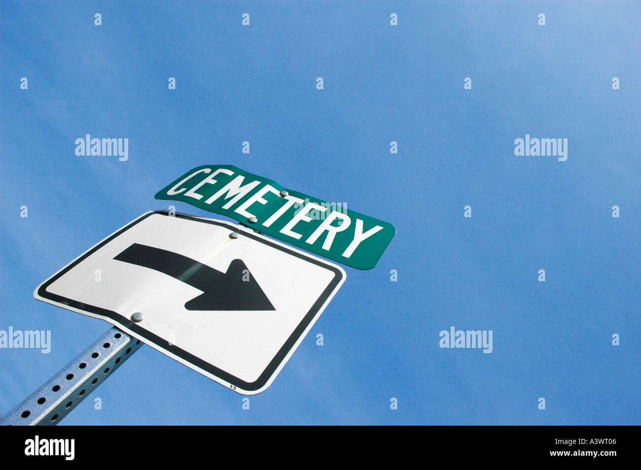 Arrow pointing to cemetery location on roadway Stock Photo - Alamy