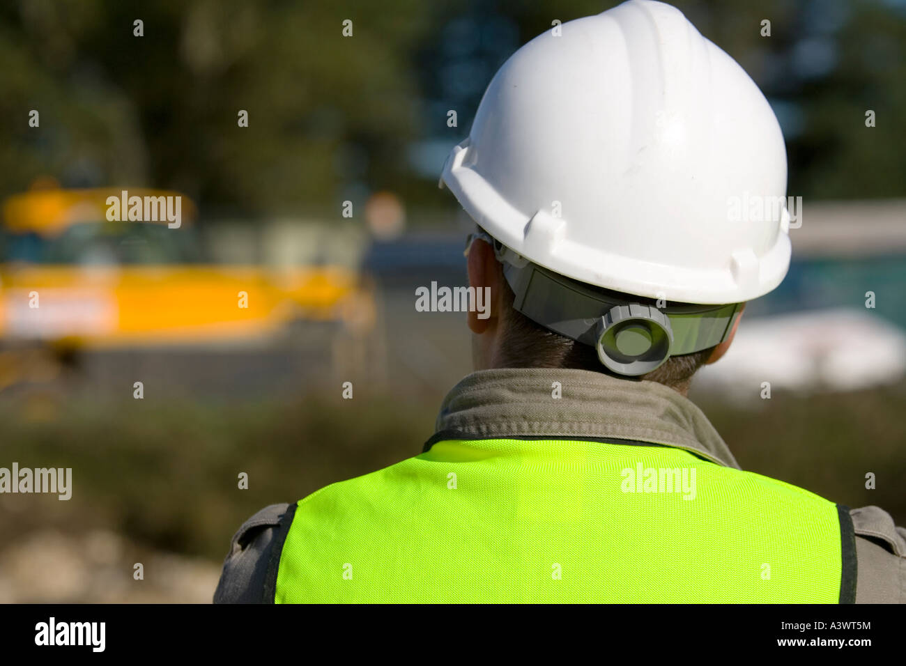 A construction worker on site and dressed in safety clothing Stock ...