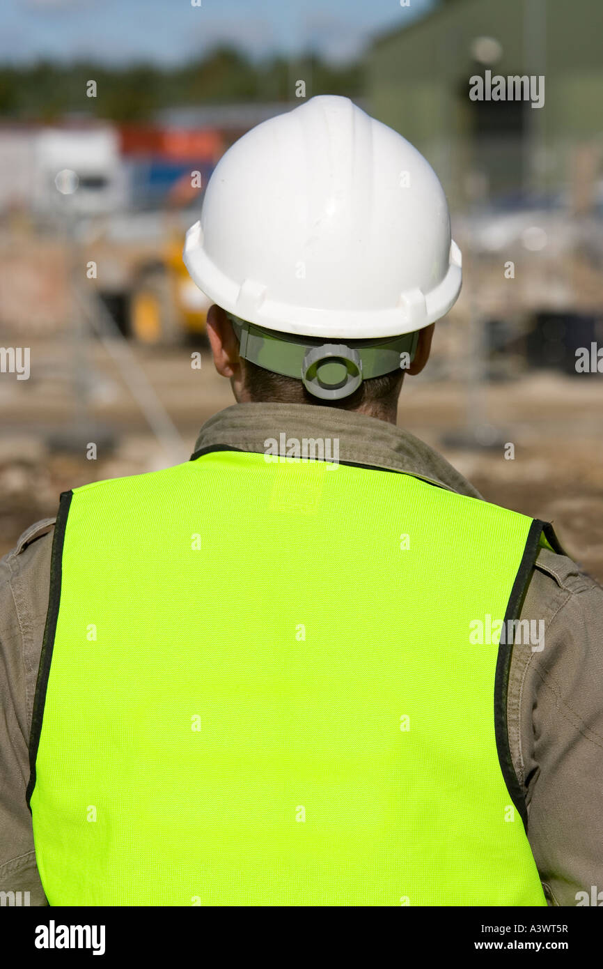 A construction worker on site and dressed in safety clothing Stock ...
