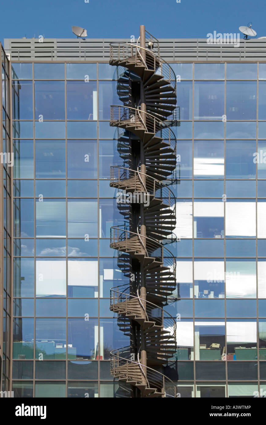 Steel spiral emergency fire escape metalwork staircase on outside ...