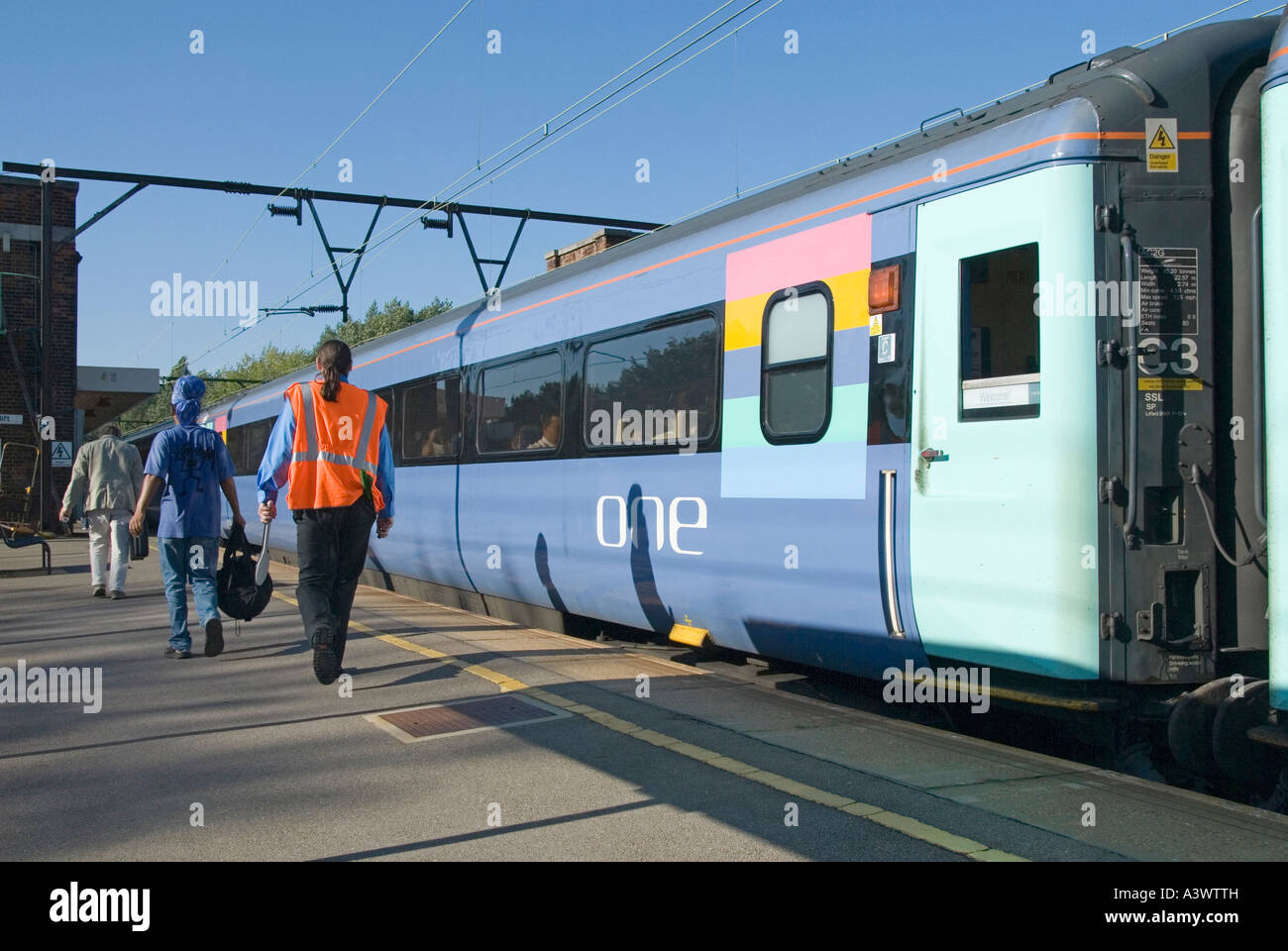 Passengers leaving One branded train at Shenfield station walking to ...