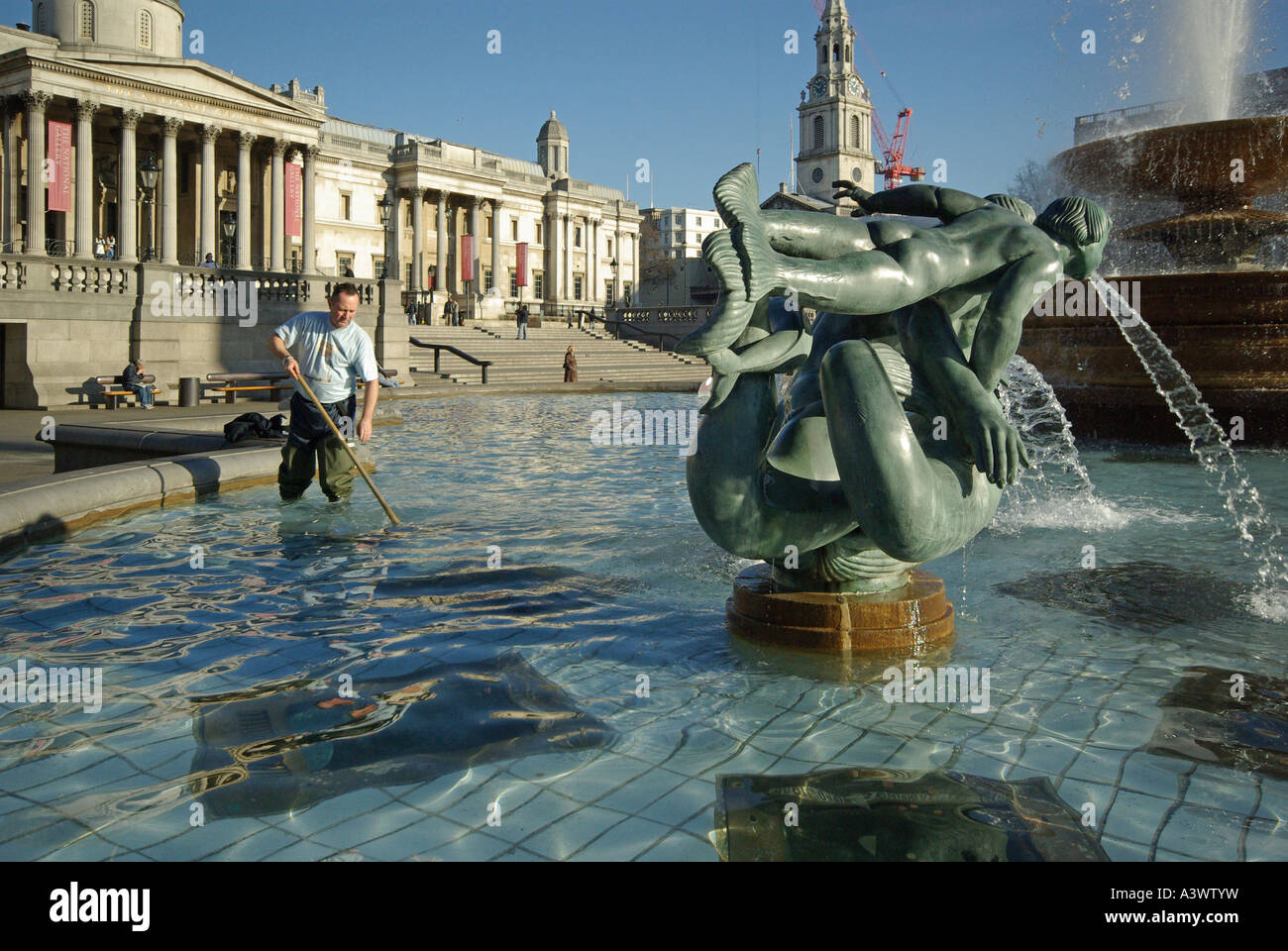Trafalgar Square fountain pool being cleaned early morning before ...