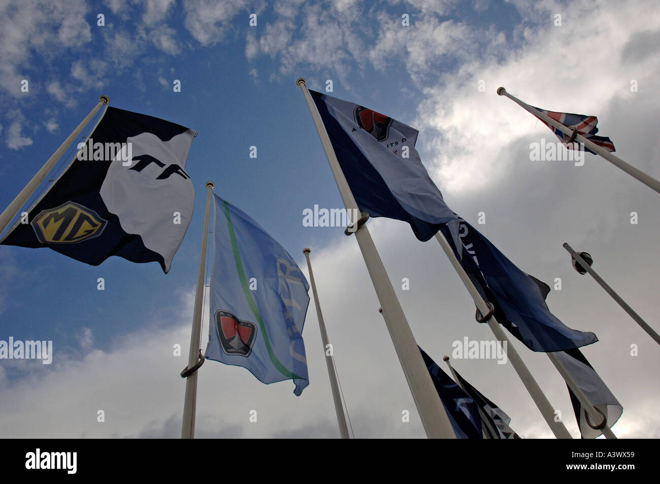Flags blow in the wind outside the MG Rover factory at Longbridge ...
