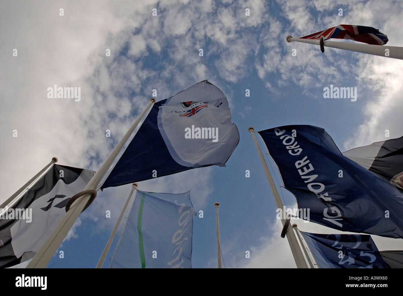 Flags blow in the wind outside the MG Rover factory at Longbridge ...
