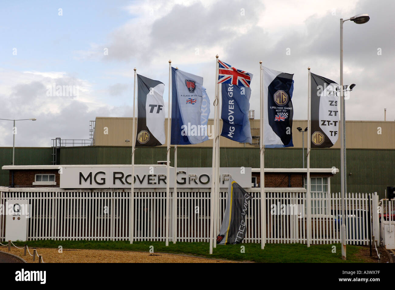 Flags blow in the wind outside the MG Rover factory at Longbridge ...