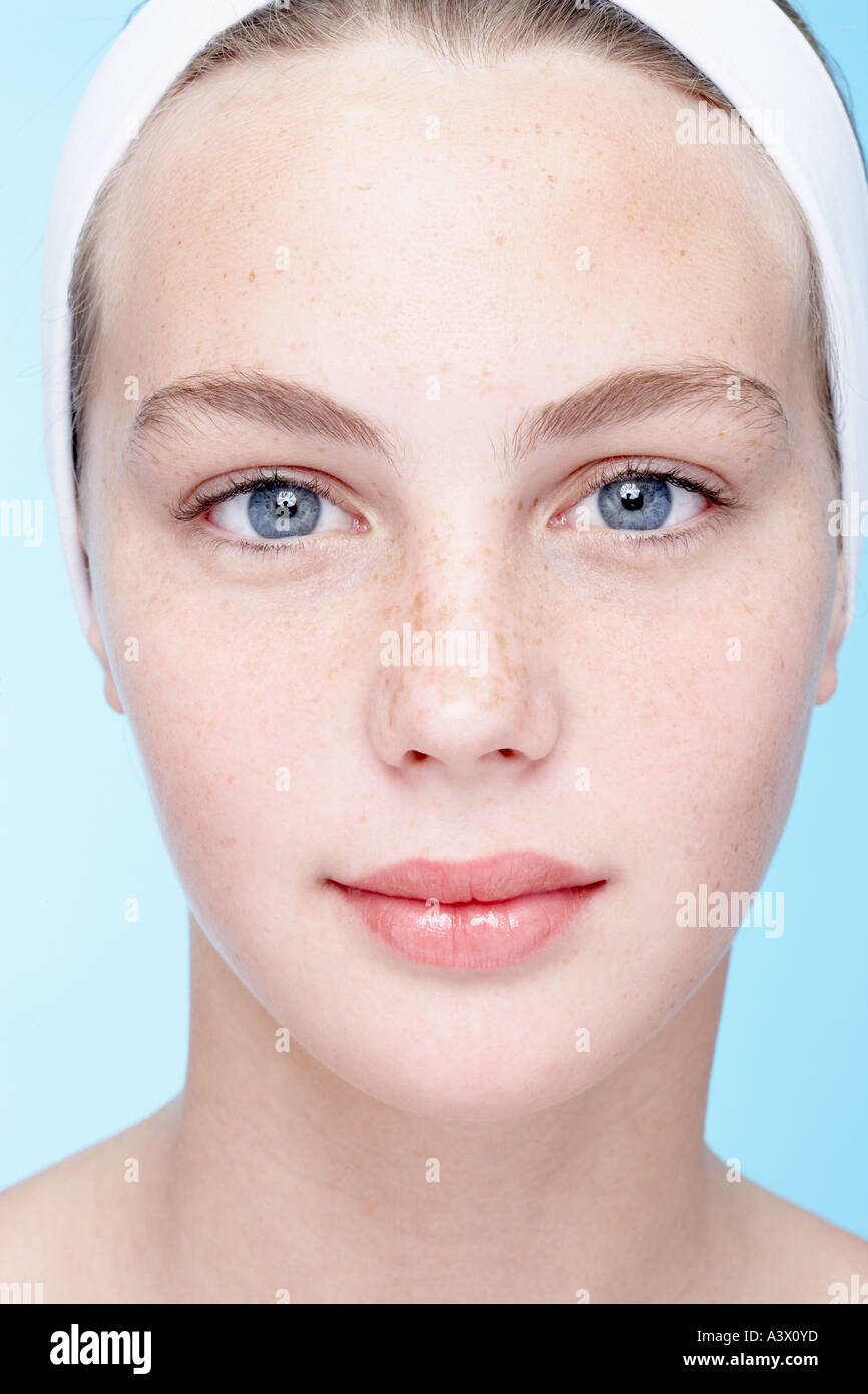 A young woman looking at camera close up Stock Photo - Alamy