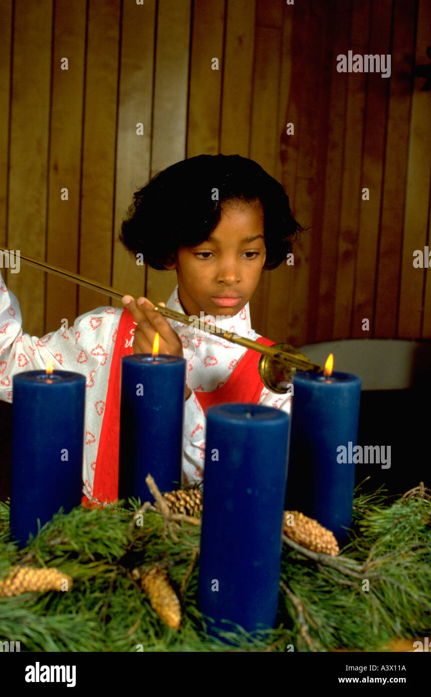 Girl lighting advent candle church hi-res stock photography and images ...
