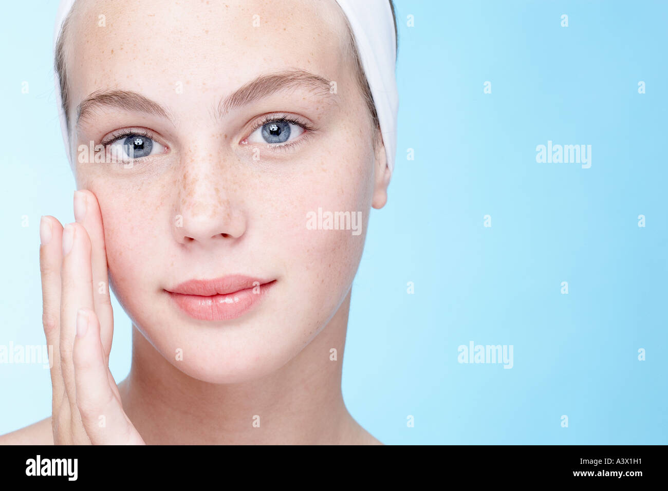 A young woman applying gel on her face Stock Photo - Alamy